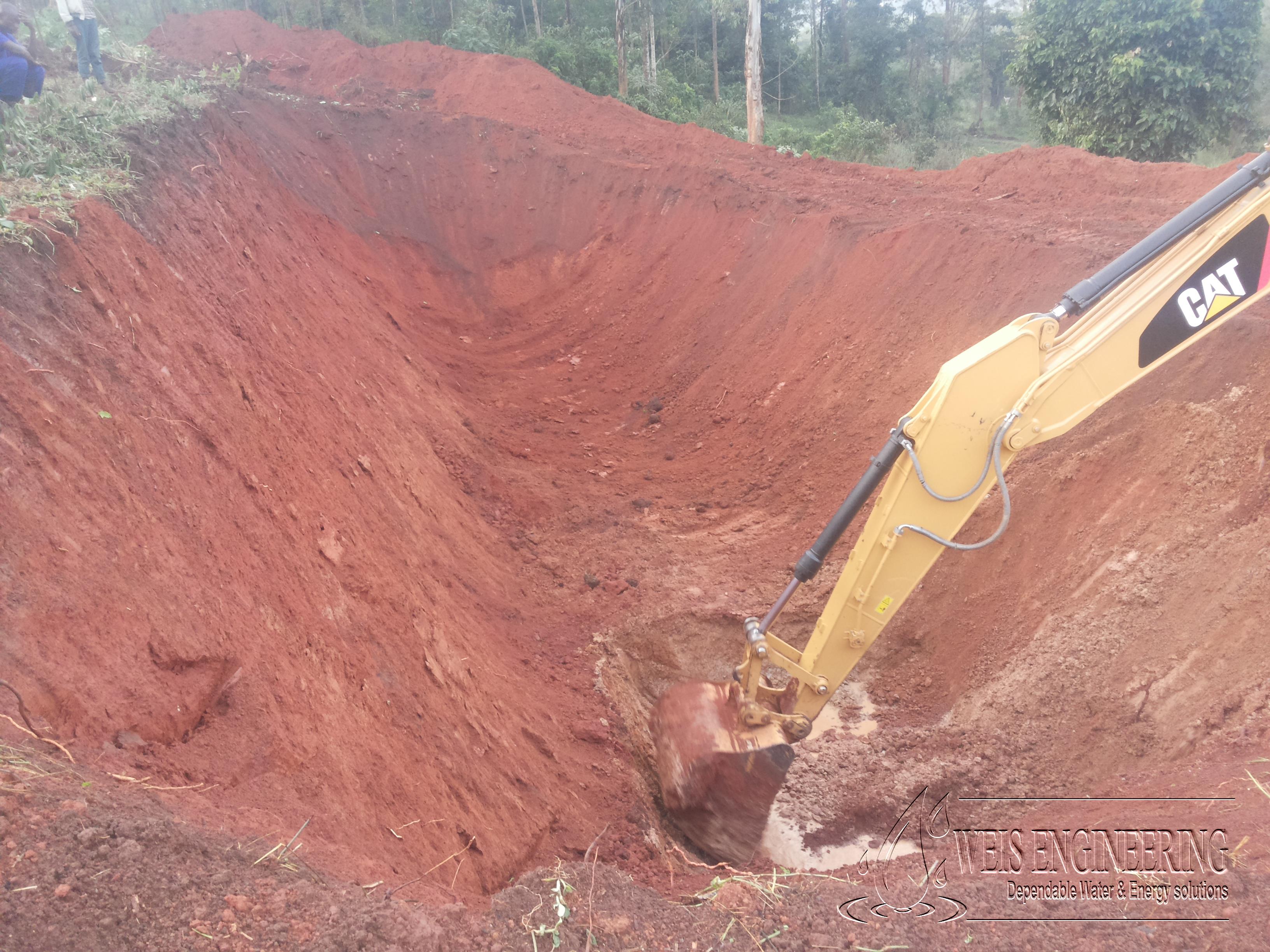 Valley tank excavation in Uganda - Weis Engineering Ltd